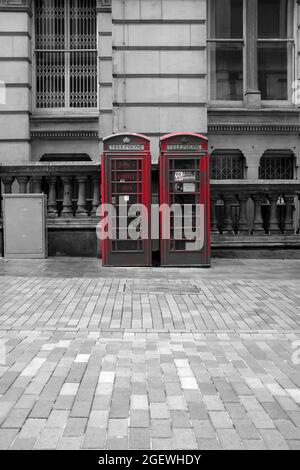 Selective colour of the Iconic red telephone boxes in Eden Place ...
