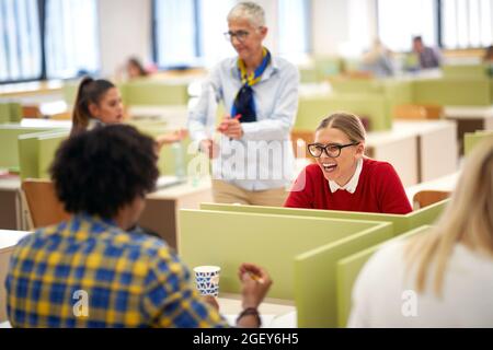 Classmates having fun in classroom Stock Photo - Alamy