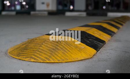 a speed bump on the pavement Stock Photo - Alamy