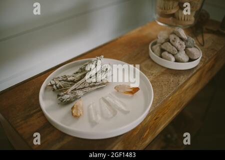 Several crystals and sage for meditation in a white plate Stock Photo ...
