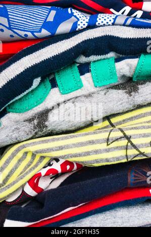 A vertical shot of stacked garment Stock Photo - Alamy