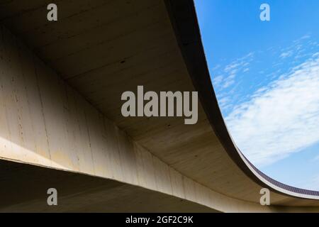 Bottom view of a curved bridge Stock Photo - Alamy