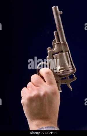 Hands with revolver Stock Photo - Alamy