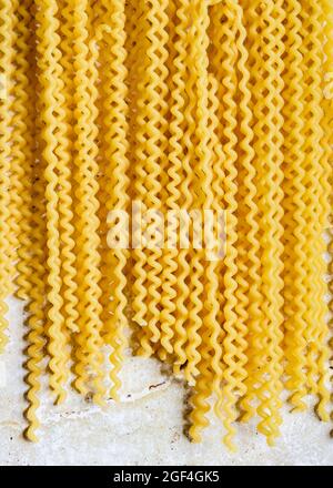 Raw Fusilli Lunghi Bucati. Traditional italian pasta on wooden table ...