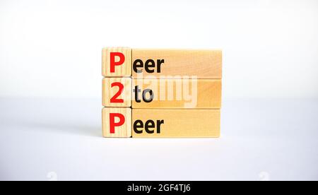 P2P, peer to peer symbol. Wooden blocks with concept words 'P2P, peer ...
