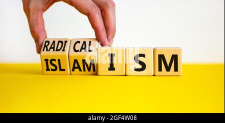 Radicalism or islamism symbol. Businessman turns cubes and changes the ...