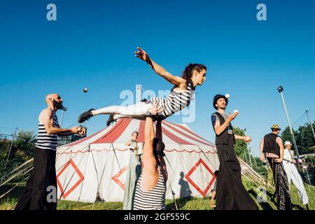 male and female performance artists juggling LED lightstick playing ...