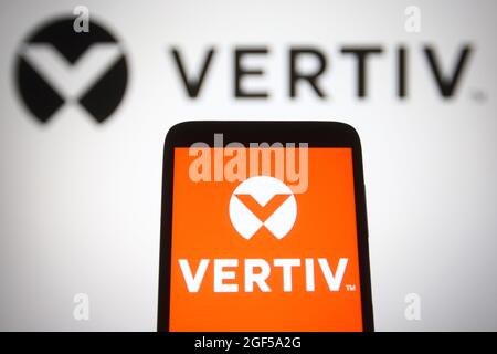 In this photo illustration, the Vertiv logo is seen displayed on a ...