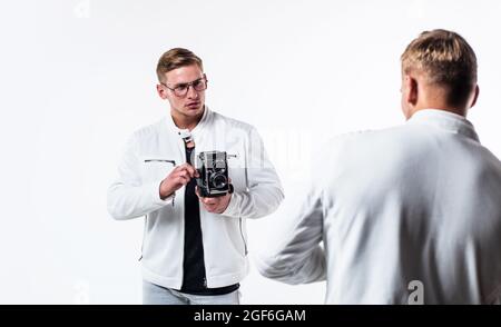 twin brothers men photographer in white casual look alike use vintage ...