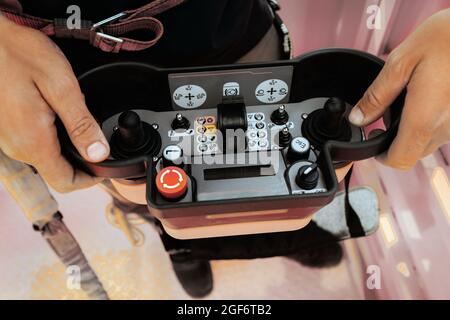 Close-up at controlling lever switch of crane truck vehicle, using to ...