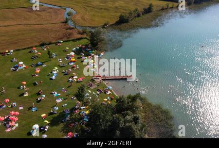 Drone shot, bathing place with colourful sunshades at the Irrsee, Zell ...