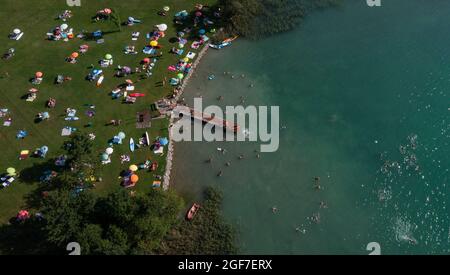 Drone shot, bathing place with colourful sunshades at the Irrsee, Zell ...