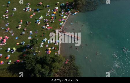 Drone shot, bathing place with colourful sunshades at the Irrsee, Zell ...