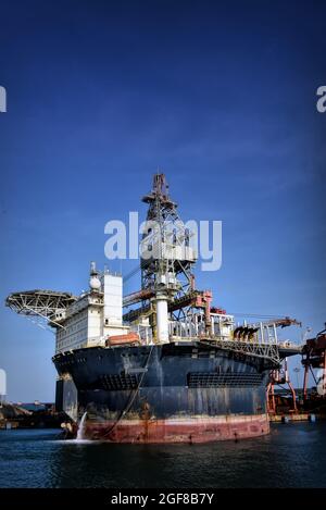 circular round shape FPSO alongside at port for maintenance and survey ...