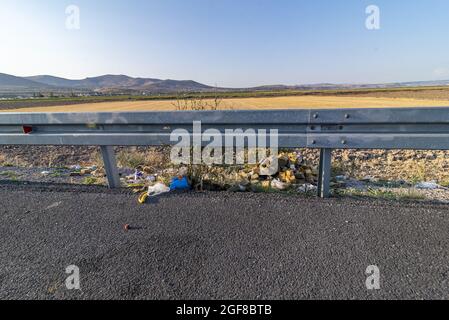 Environmental pollution on highway sides. household waste Stock Photo ...