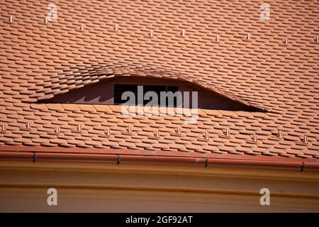 Newly tiled roof in Transylvania, Romania with dormer windows typical ...