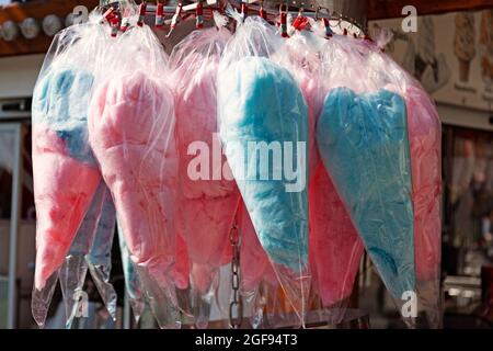 Cotton candy in pink, blue and purple colors isolated on a white ...