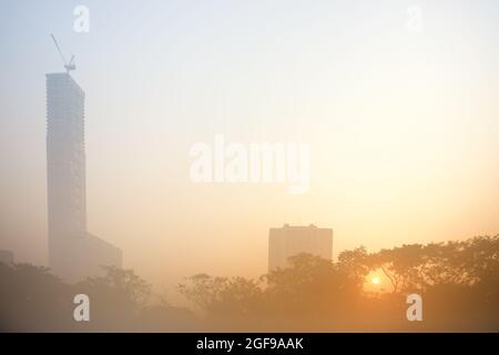 Beautiful image of sunrise at Kolkata maidan in a foggy winter morning ...
