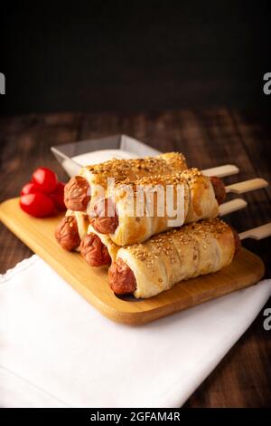 Homemade sausages in dough on white plate Stock Photo - Alamy