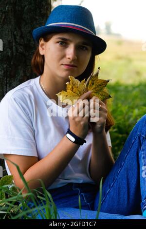 Defocus close up portrait of a serious tired young woman with brown ...