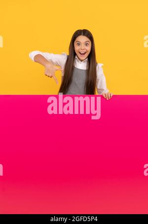 presenting copy space. amazed kid with curly hair in christmas ...