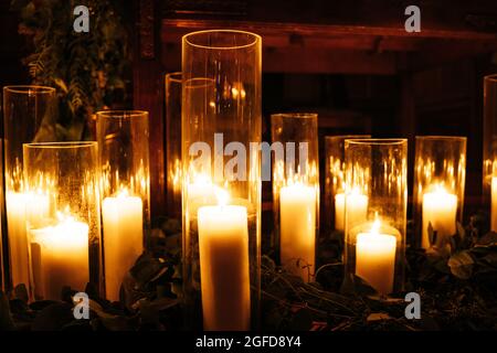 Dark room with lit candles decorating it Stock Photo - Alamy