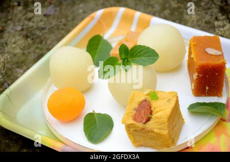 closeup the bunch syrup filled ball sweet with green mint over out of ...