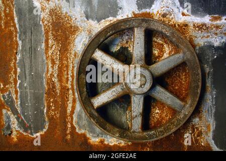 Rusty brown iron wheel in autumn field Stock Photo - Alamy