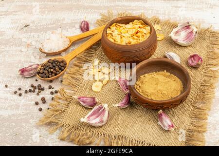Fresh garlic and its products: dried chunks and powder. Natural ...