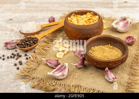 Fresh garlic and its products: dried chunks and powder. Natural ...