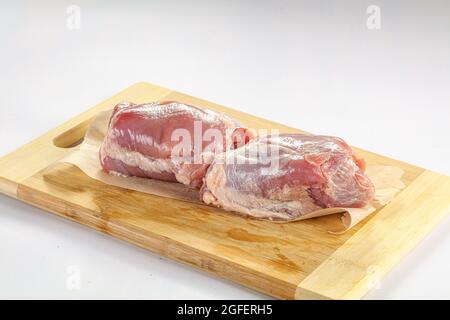 Raw turkey hip fillet isolated for cooking Stock Photo - Alamy