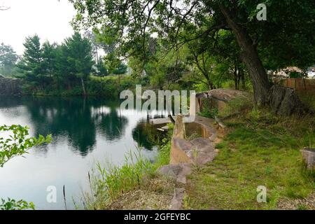 Old abandoned quarry lake filled with emerald water with radon Stock ...