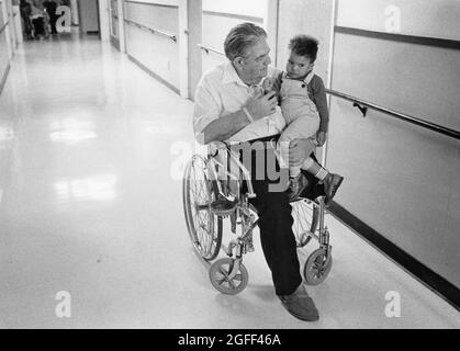 Austin Texas USA, 1990: Handicapped wheelchair athlete crosses finish ...
