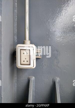 Outdoor electrical outlet with cover in beige stucco wall Stock Photo ...