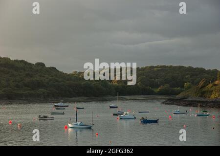 Boat anchorage in the mild light of evening at Oysterhaven Bay near ...