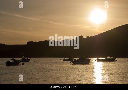 Boat anchorage in the mild light of evening at Oysterhaven Bay near ...