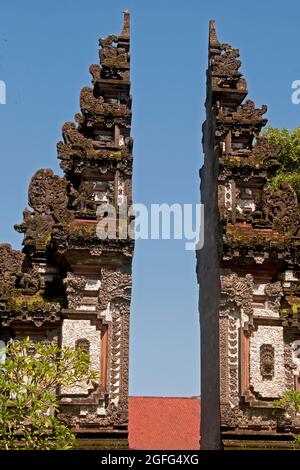 A traditional candi bentar, or split gateway, at the entrance to a ...