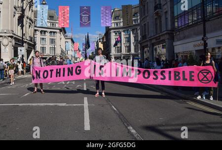 Protesters hold a banner which says 'Nothing Is Impossible' during the ...