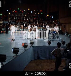 Tony Hicks of British pop group The Hollies sees off his model ...