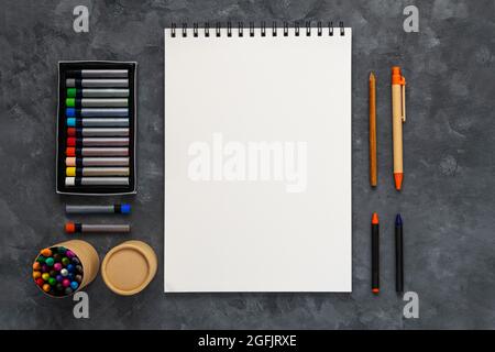 Blank notebook mockup pastel pad dark background flat lay. Minimal work ...