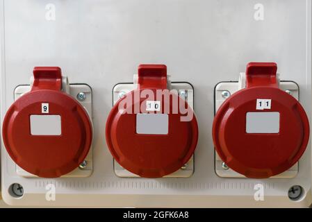 Industrial sockets on distribution board with circuit breakers. Construction site electricity ...