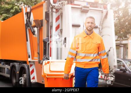 Garbage Removal Man Doing Trash And Rubbish Collection Stock Photo - Alamy
