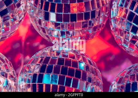disco balls for decorationof a party on pink background Stock Photo - Alamy