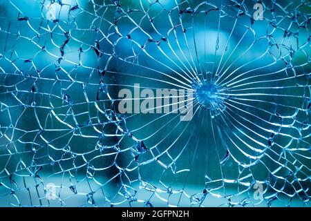 Shattered safety glass with blue, purple and teal hues Stock Photo - Alamy