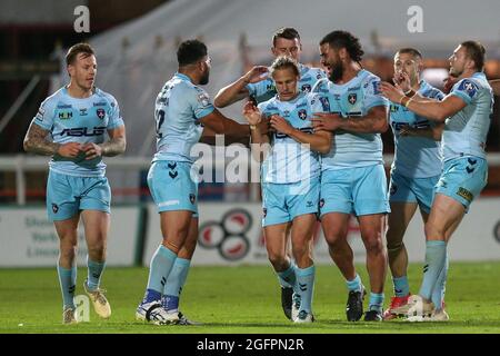 Jacob Miller (6) of Wakefield Trinity is congratulated by team mates ...