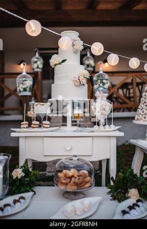 Corner with cakes and desserts for the wedding ceremony Stock Photo - Alamy