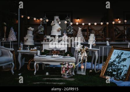 Corner with cakes and desserts for the wedding ceremony Stock Photo - Alamy