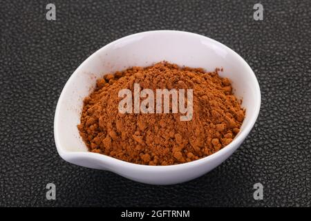 Cocoa powder in the bowl - ready for cooking Stock Photo - Alamy