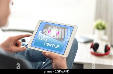 Tablet screen displaying a call center concept Stock Photo - Alamy