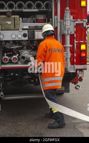 German firefighter in a action with a fire extinguisher Stock Photo - Alamy